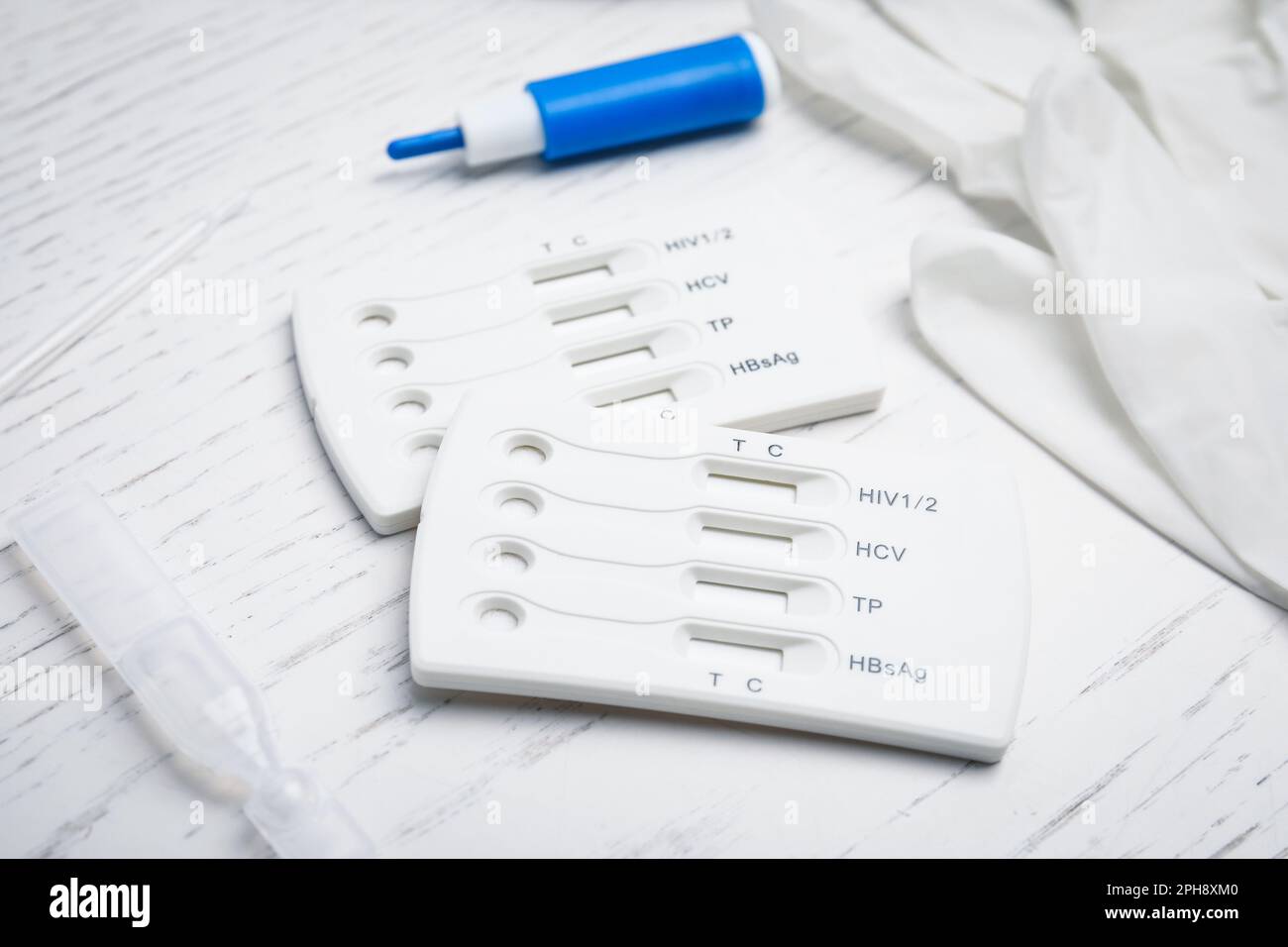 Disposable express test kit for hepatitis on white wooden table Stock ...