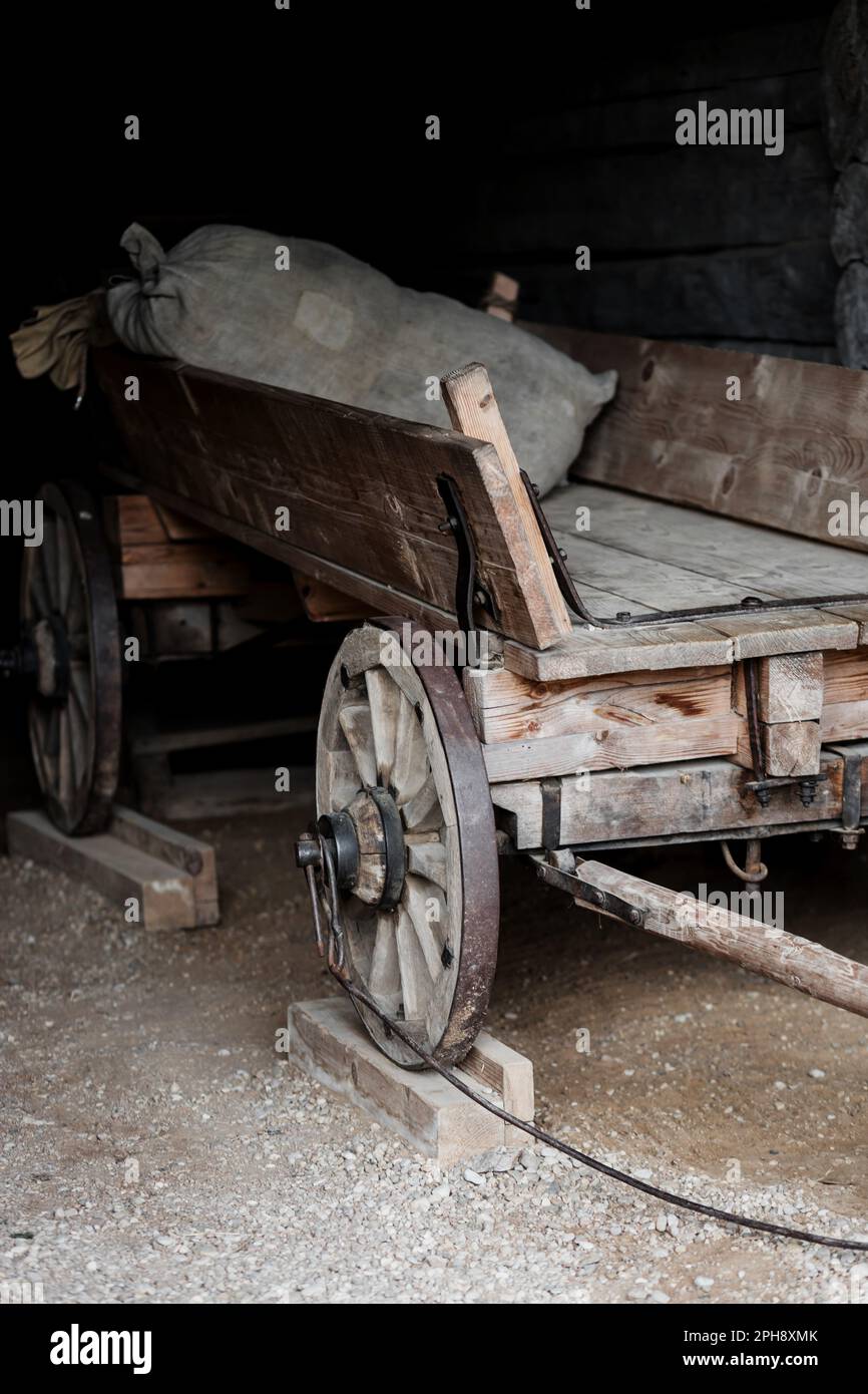 Old wooden farm wagon. Vintage cart in the barn Stock Photo - Alamy