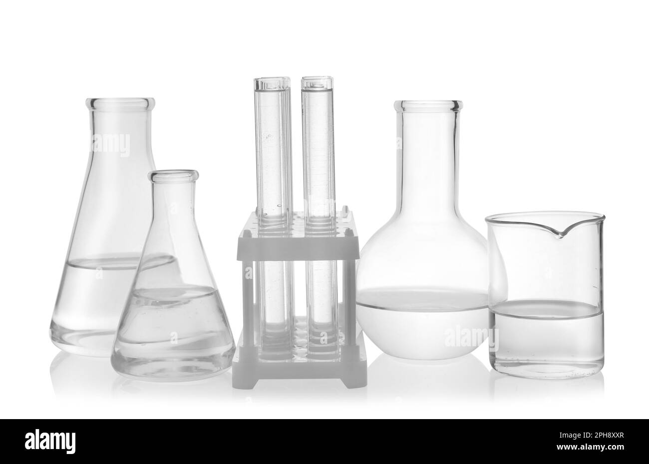 Laboratory glassware with transparent liquid on white background Stock ...