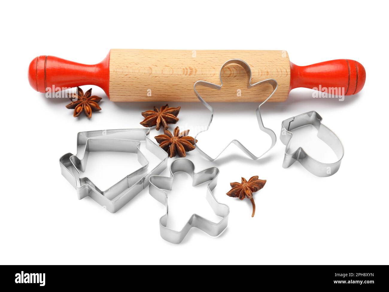 Cookie cutters, rolling pin and anise stars on white background Stock ...