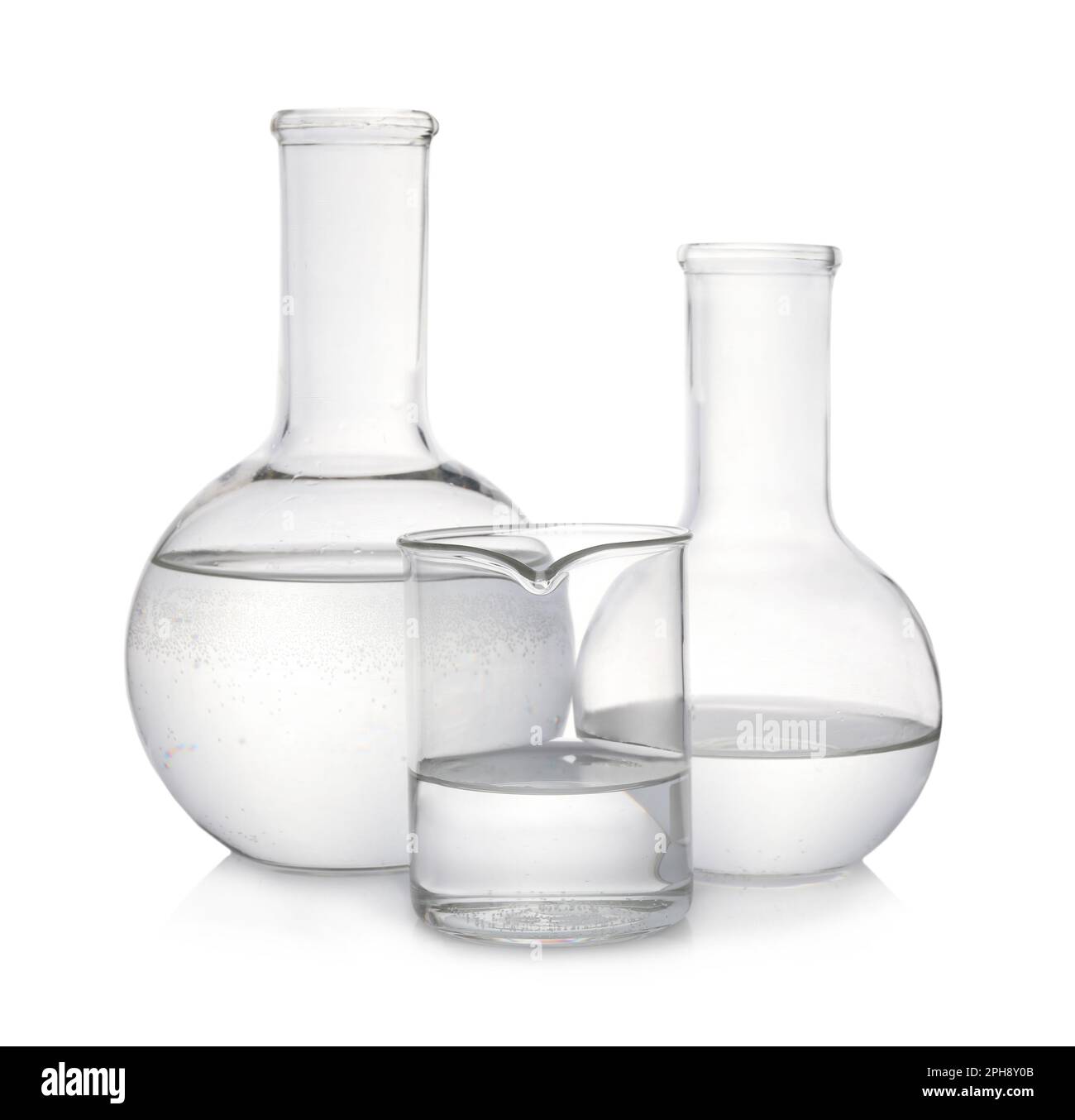 Laboratory glassware with transparent liquid on white background Stock ...