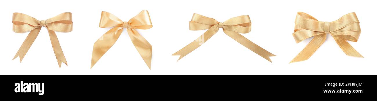 Set with beautiful golden ribbons tied in bows on white background ...