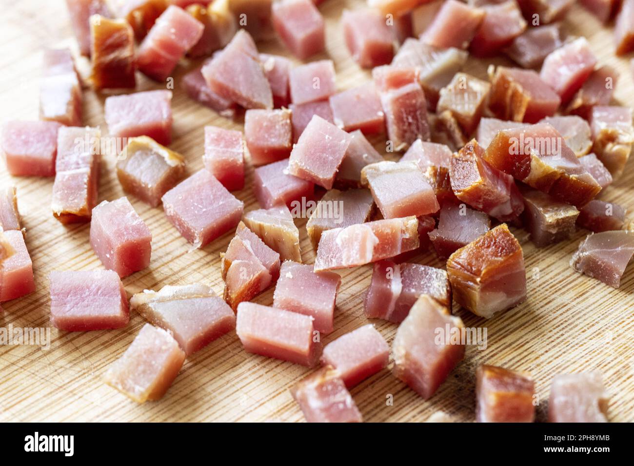 Smoked meat cut into cubes Stock Photo - Alamy