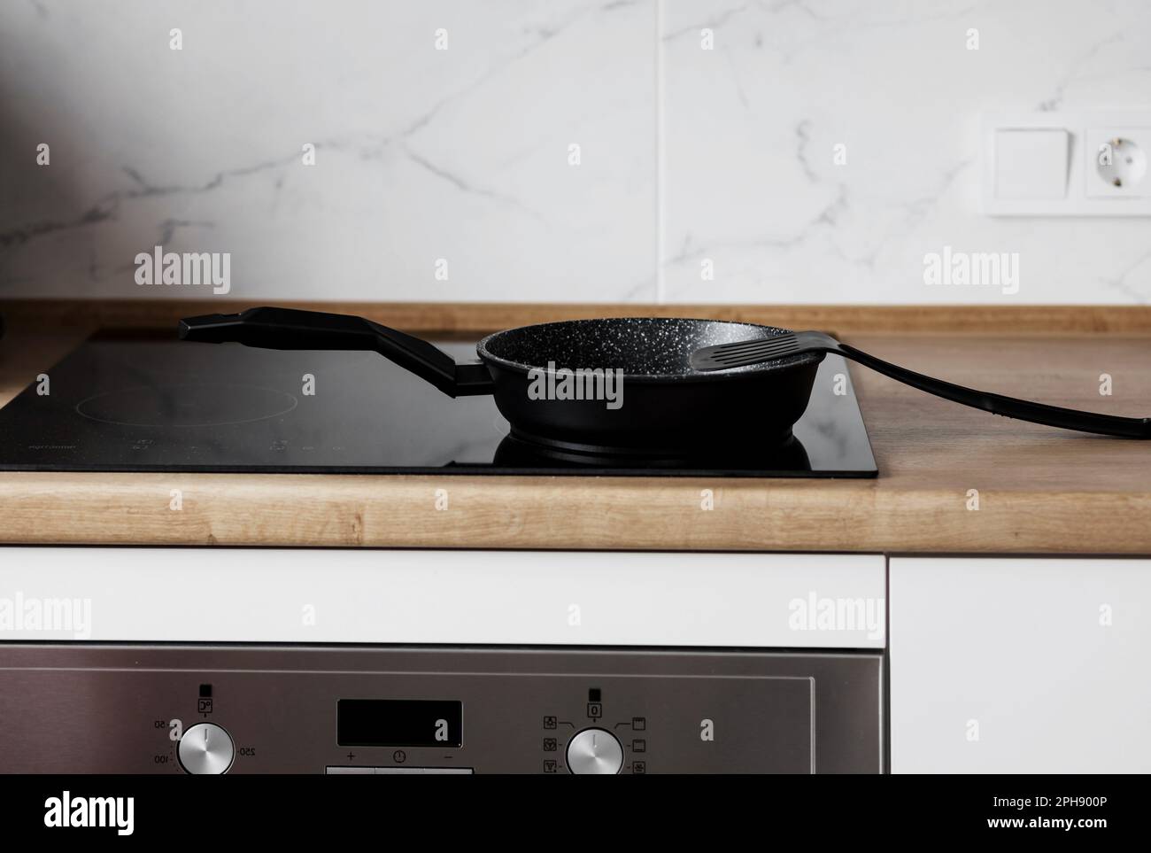 Frying pan in modern with induction stove. kitchen interior Stock Photo ...