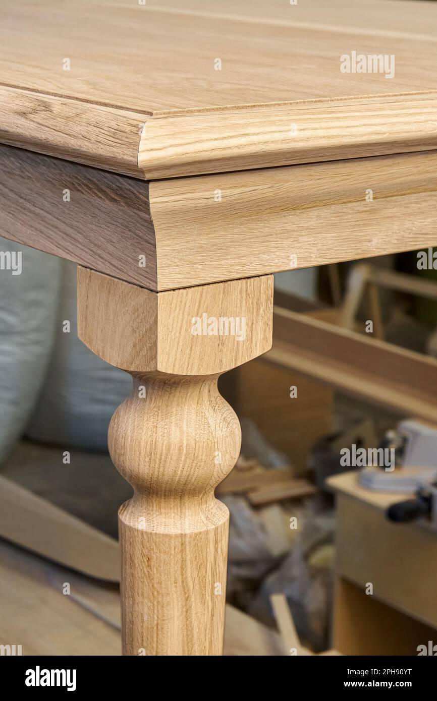 Wooden dining table with carved leg of solid oak and metal frame build ...