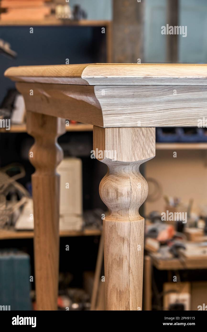Wooden dining table with carved leg of solid oak and metal frame build ...