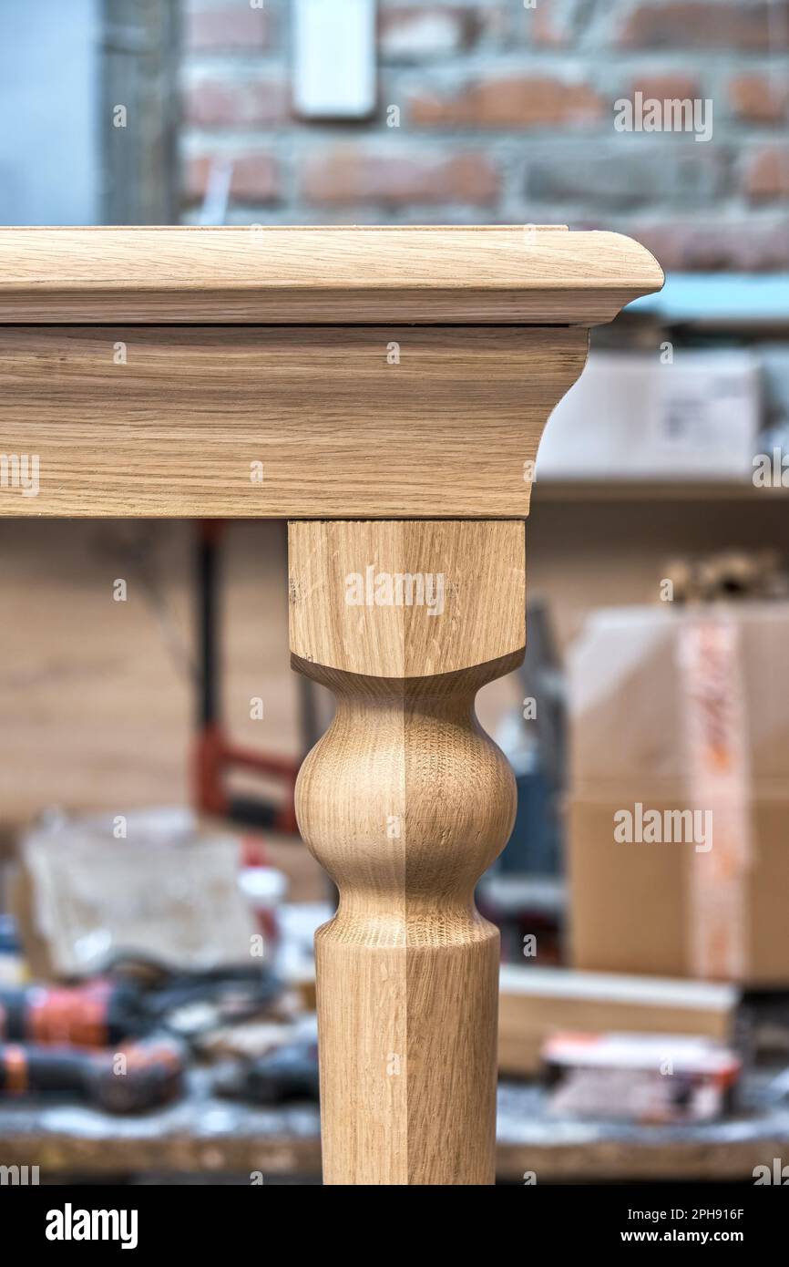Wooden dining table with carved leg of solid oak and metal frame build ...