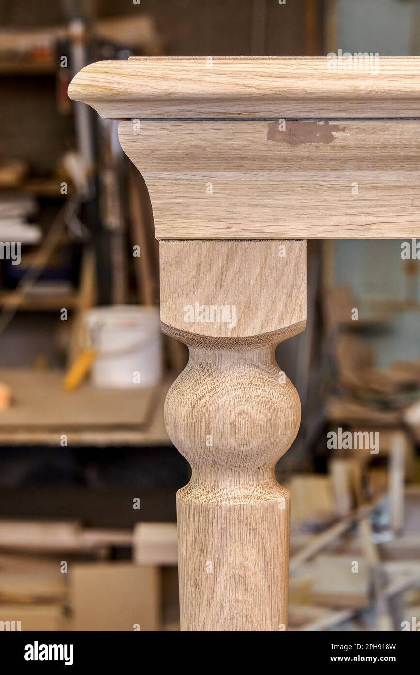 Wooden dining table with carved leg of solid oak and metal frame build ...