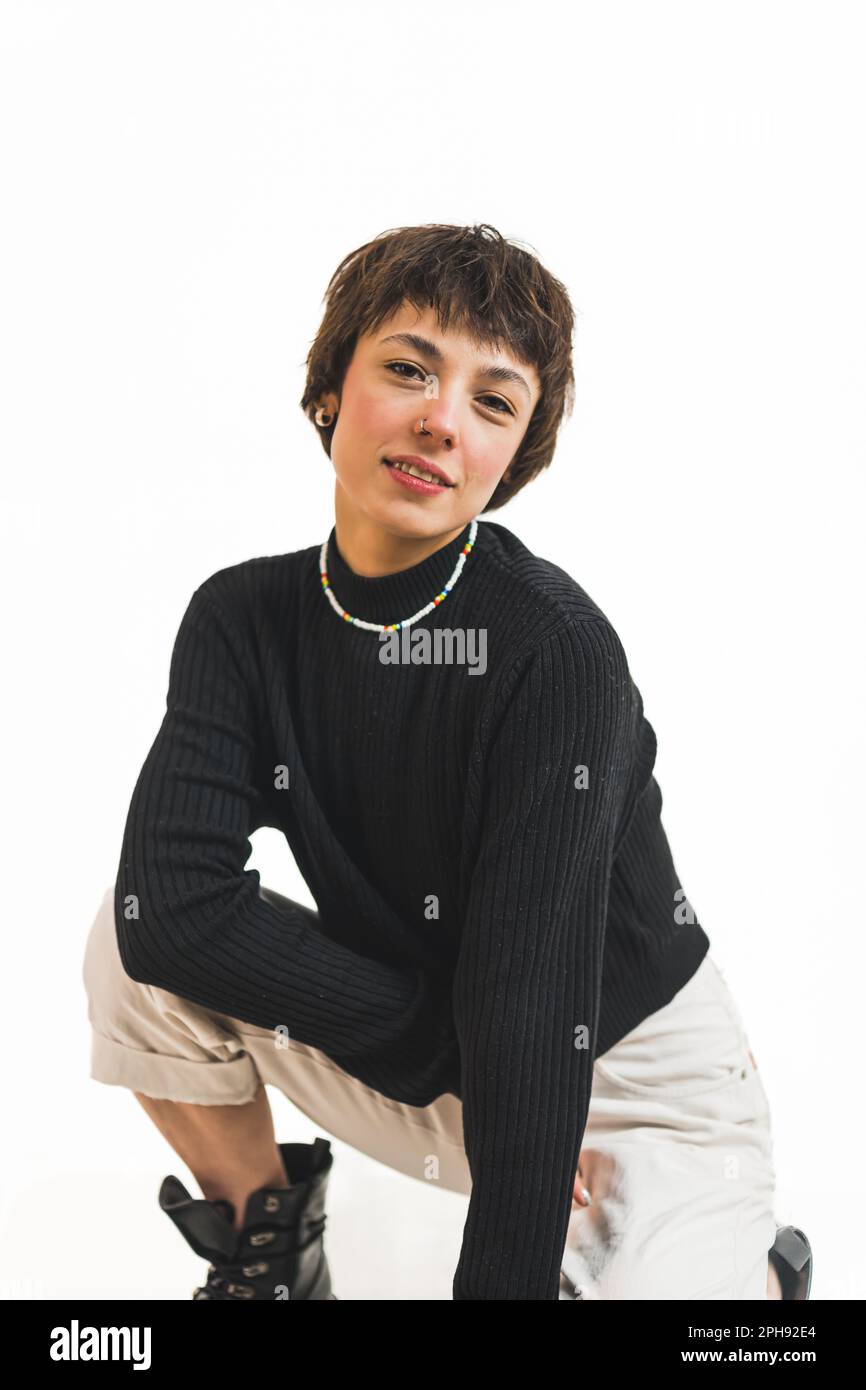 Photoshoot of a adult model girl kneeling on one leg which is dressed ...