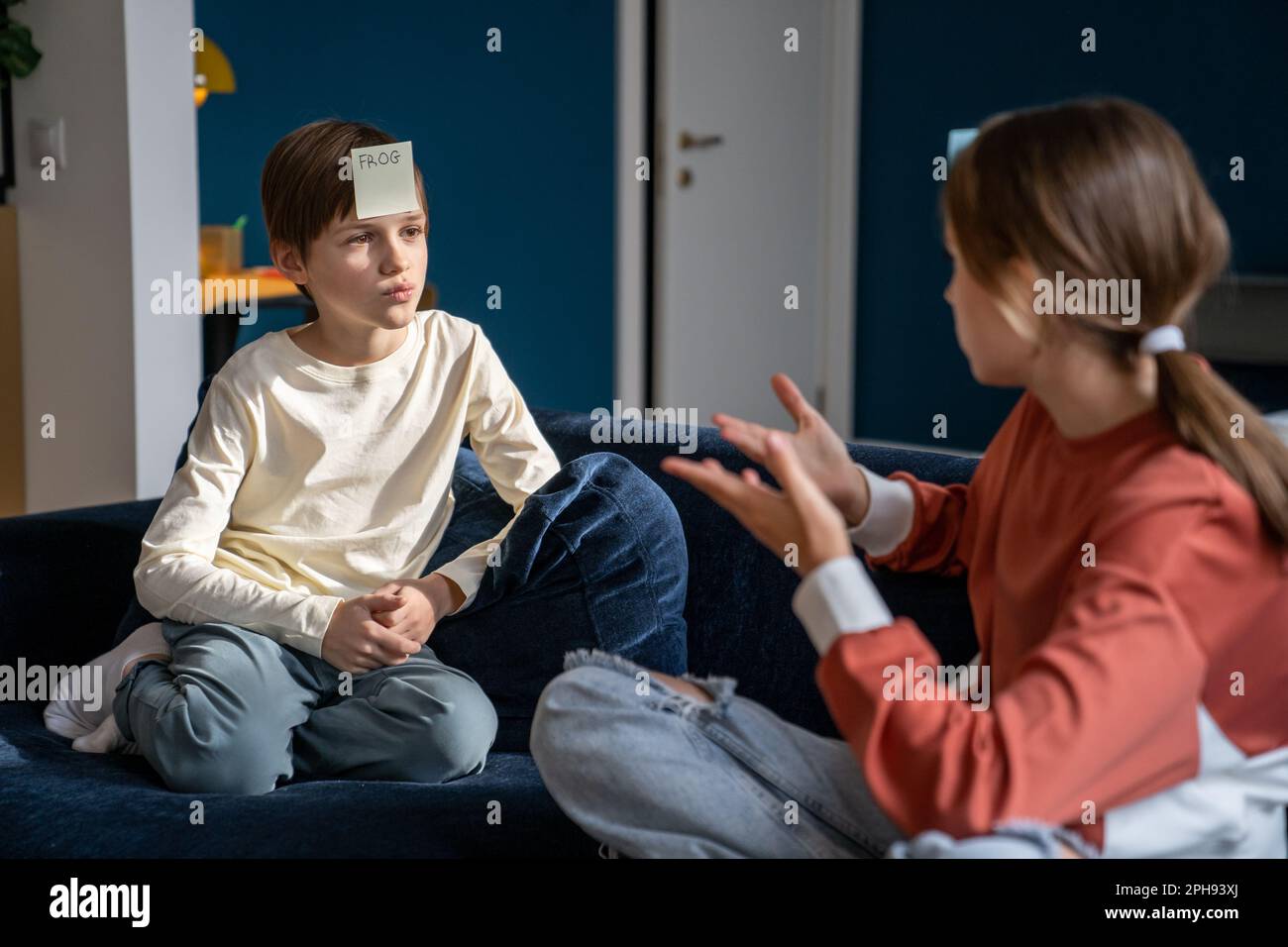 Playful interested diverse pensive children boy and girl with stickers ...