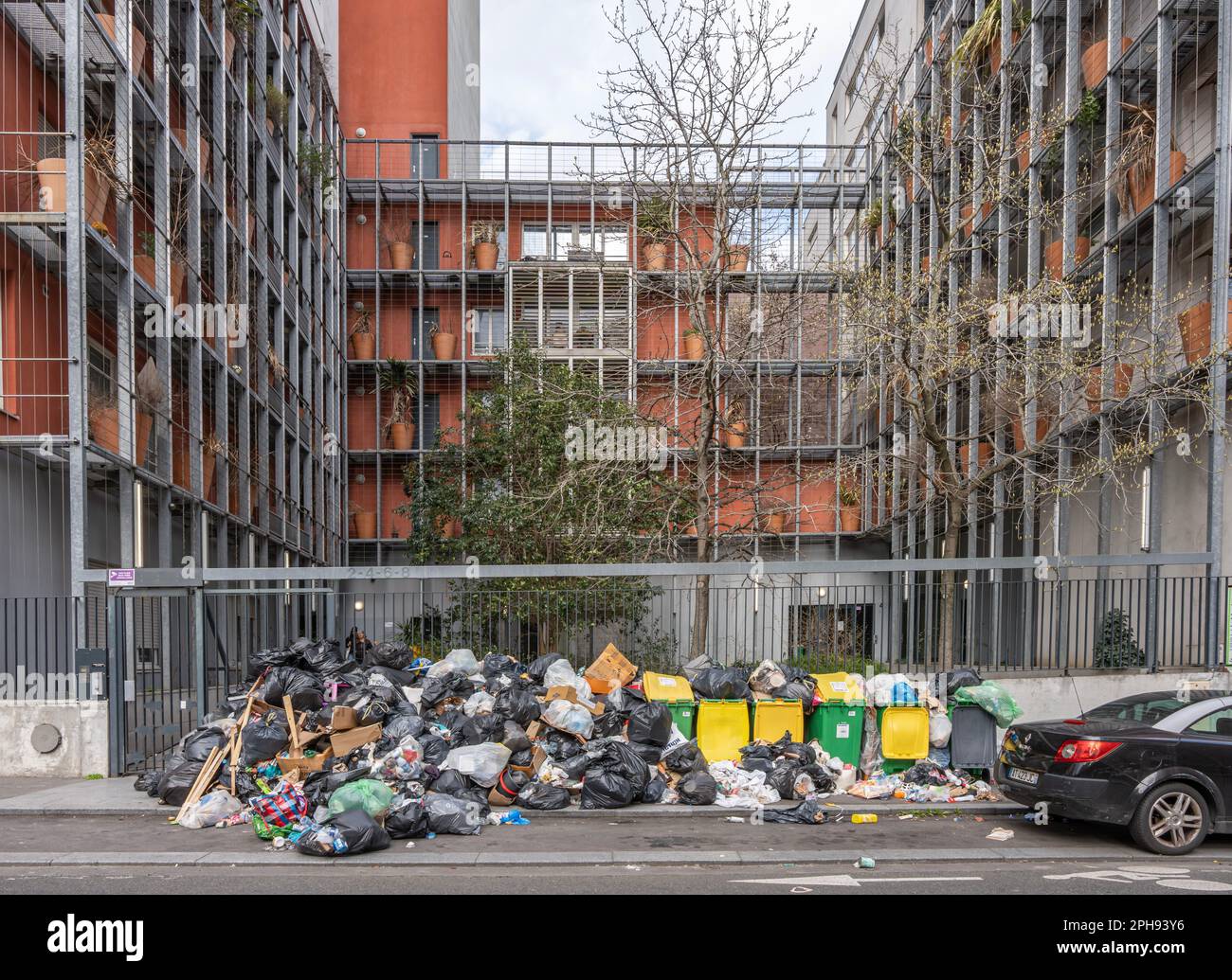 Paris, France - 03 24 2023: Garbage cans left on the public highway ...