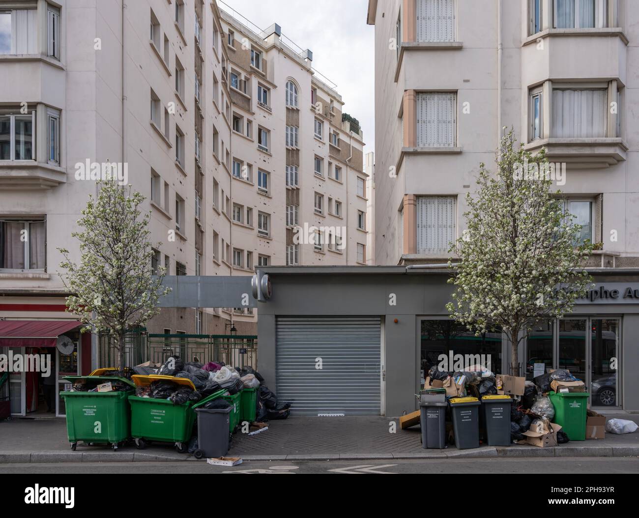 Paris, France - 03 24 2023: Garbage cans left on the public highway ...