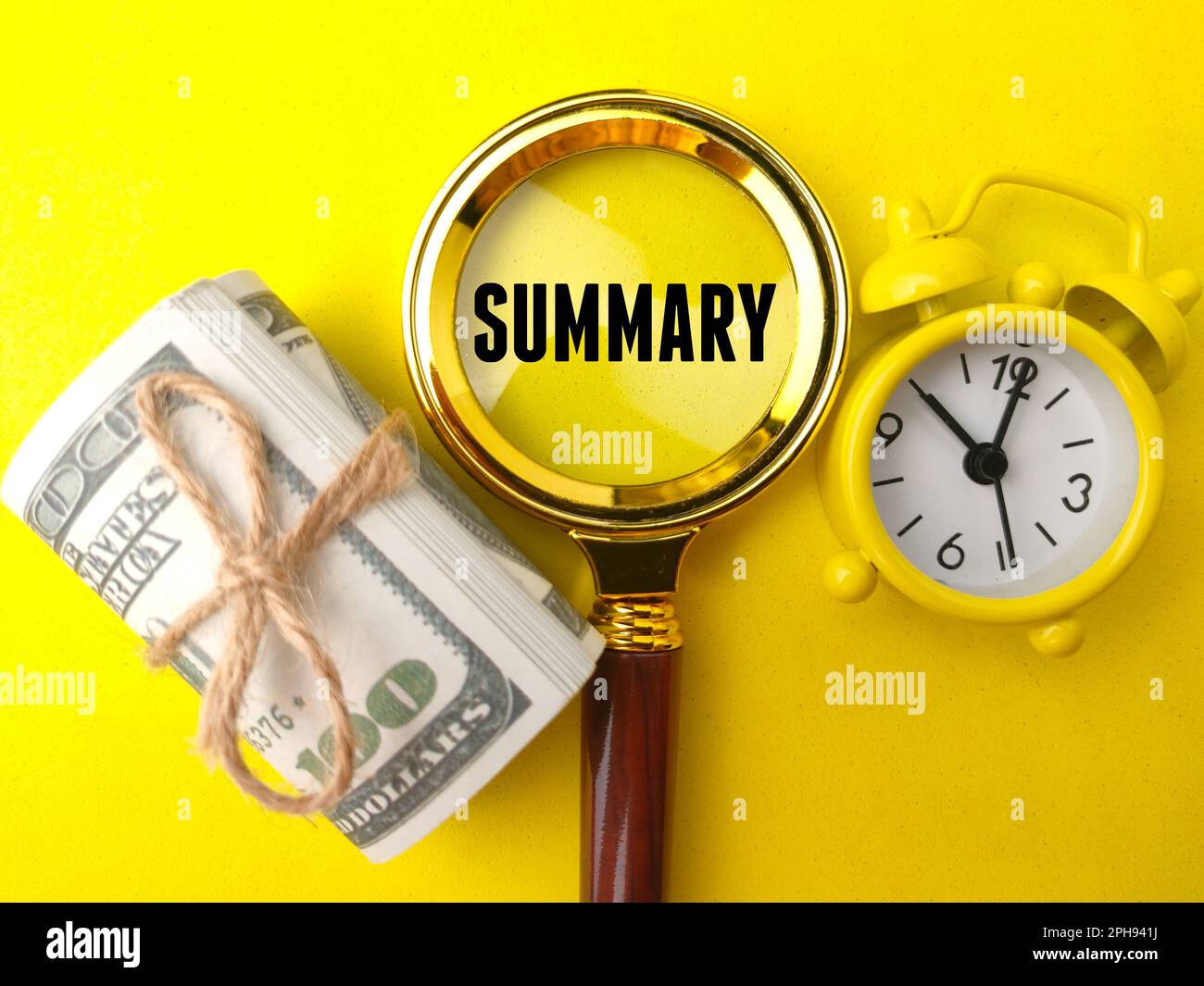 Banknotes,magnifying glass and clock with the word SUMMARY Stock Photo ...