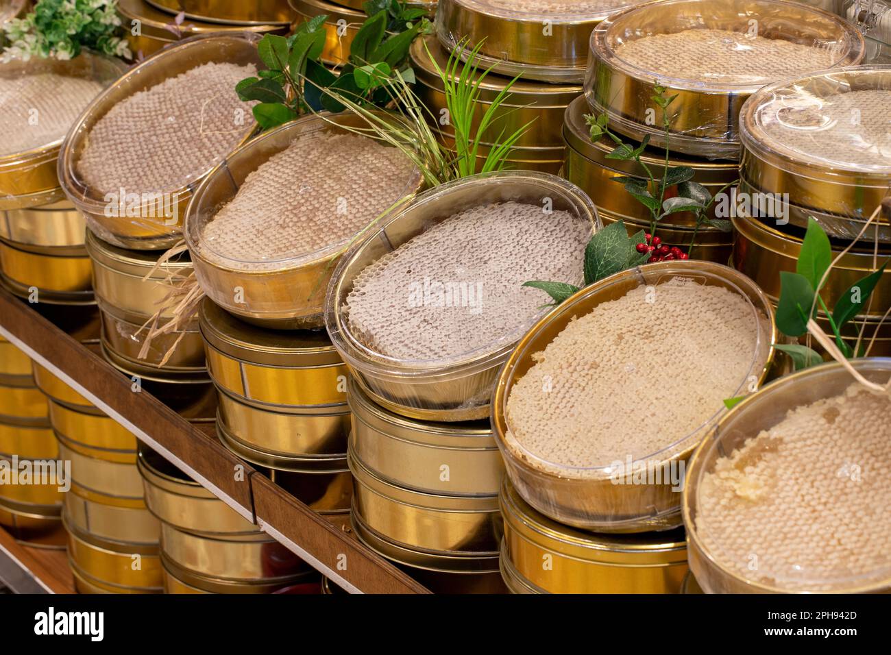 Packaged hive honey. Packaged organic honey in the deli section Stock ...