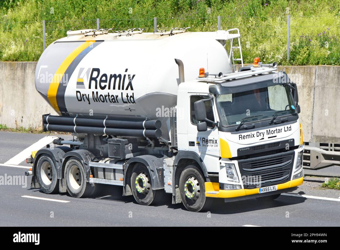 Font & side view Volvo FM rigid body tanker lorry truck on M25 motorway ...