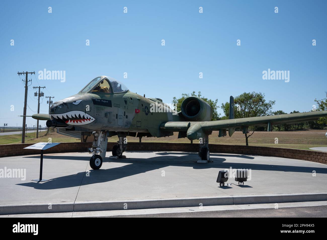 An image of a vintage fighter jet featuring a shark-like mouth painted ...