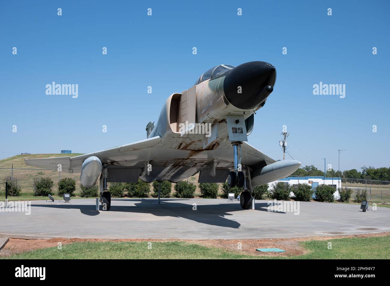 A sleek and futuristic fighter jet is soaring through a brilliantly ...