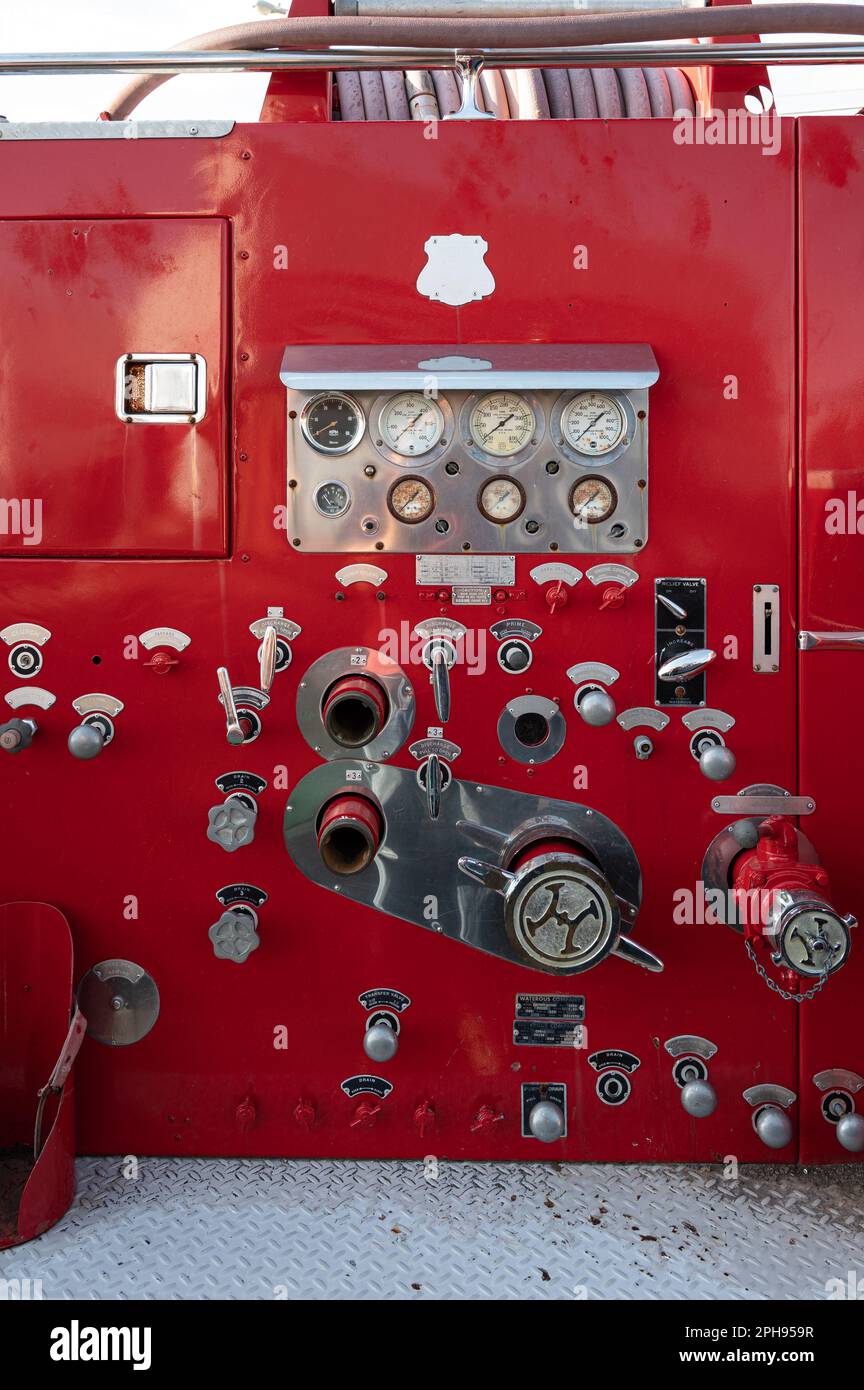 An image of an old fire truck displaying a red metal engine on top of ...