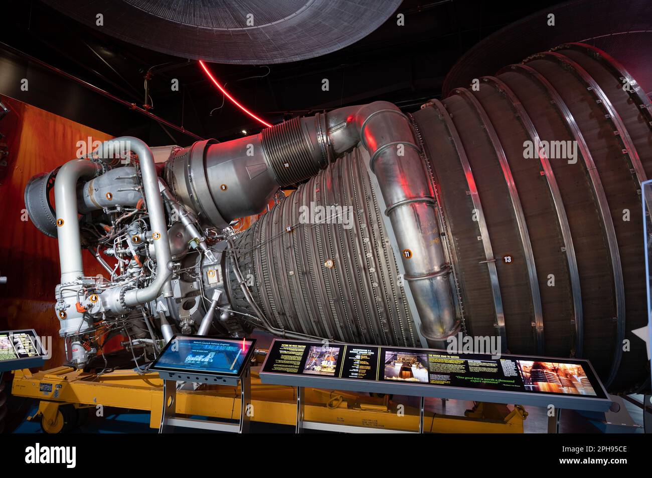A vintage rocket engine on display in a museum setting, highlighting ...