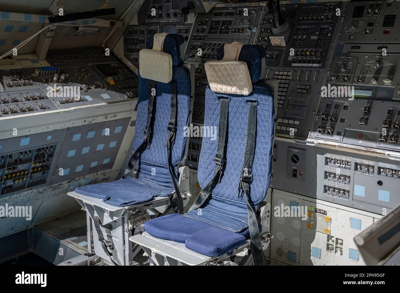 Two passenger seats in the cockpit of an airplane Stock Photo - Alamy