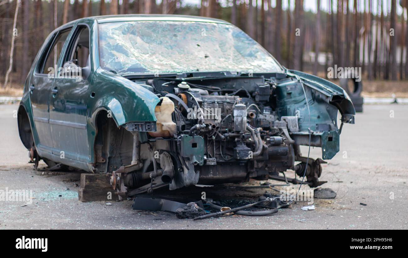 Broken crumpled car after a severe accident with a skewed body, after a ...