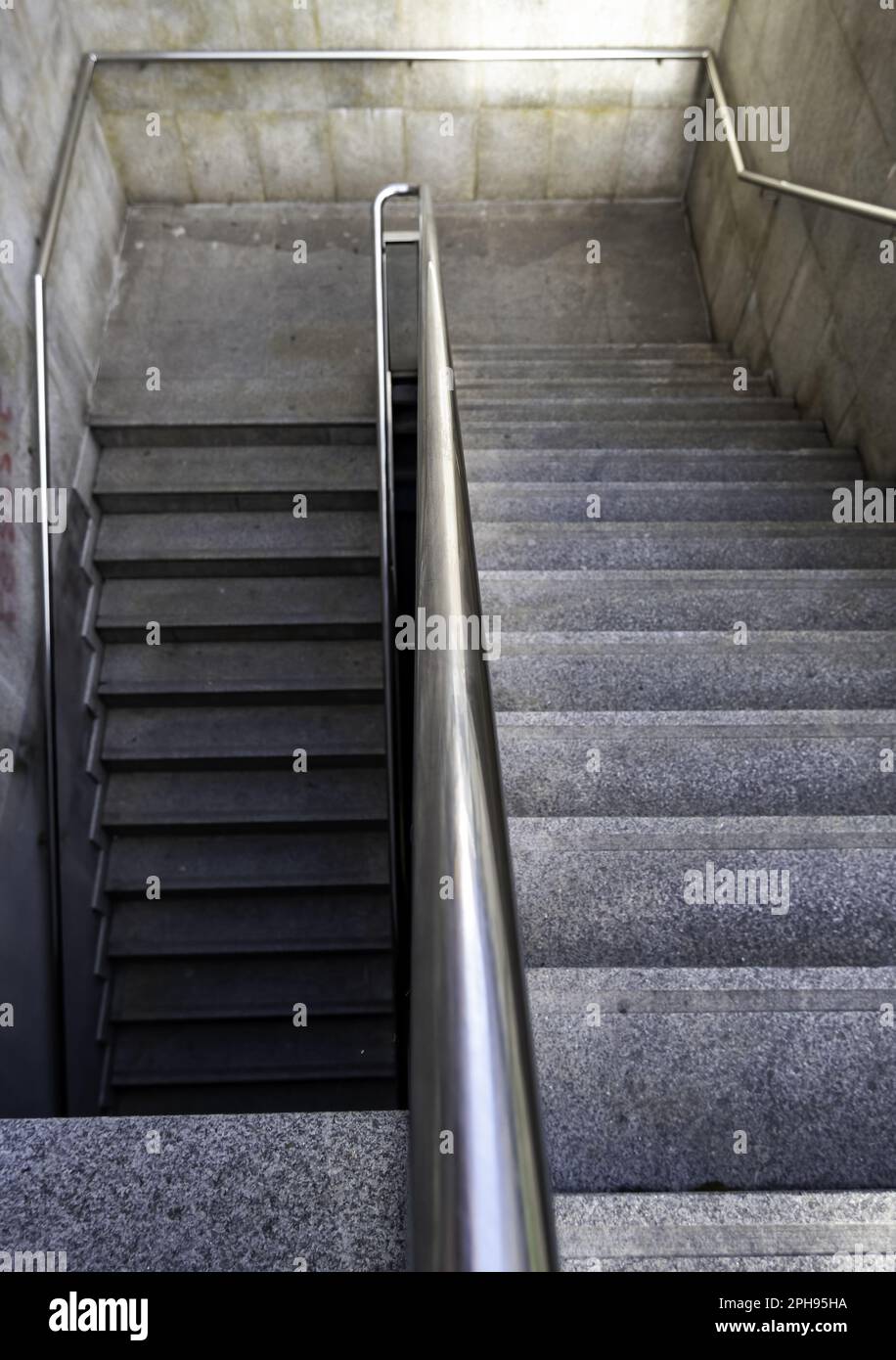 Detail of access stairs for pedestrians in a street in the city, access ...