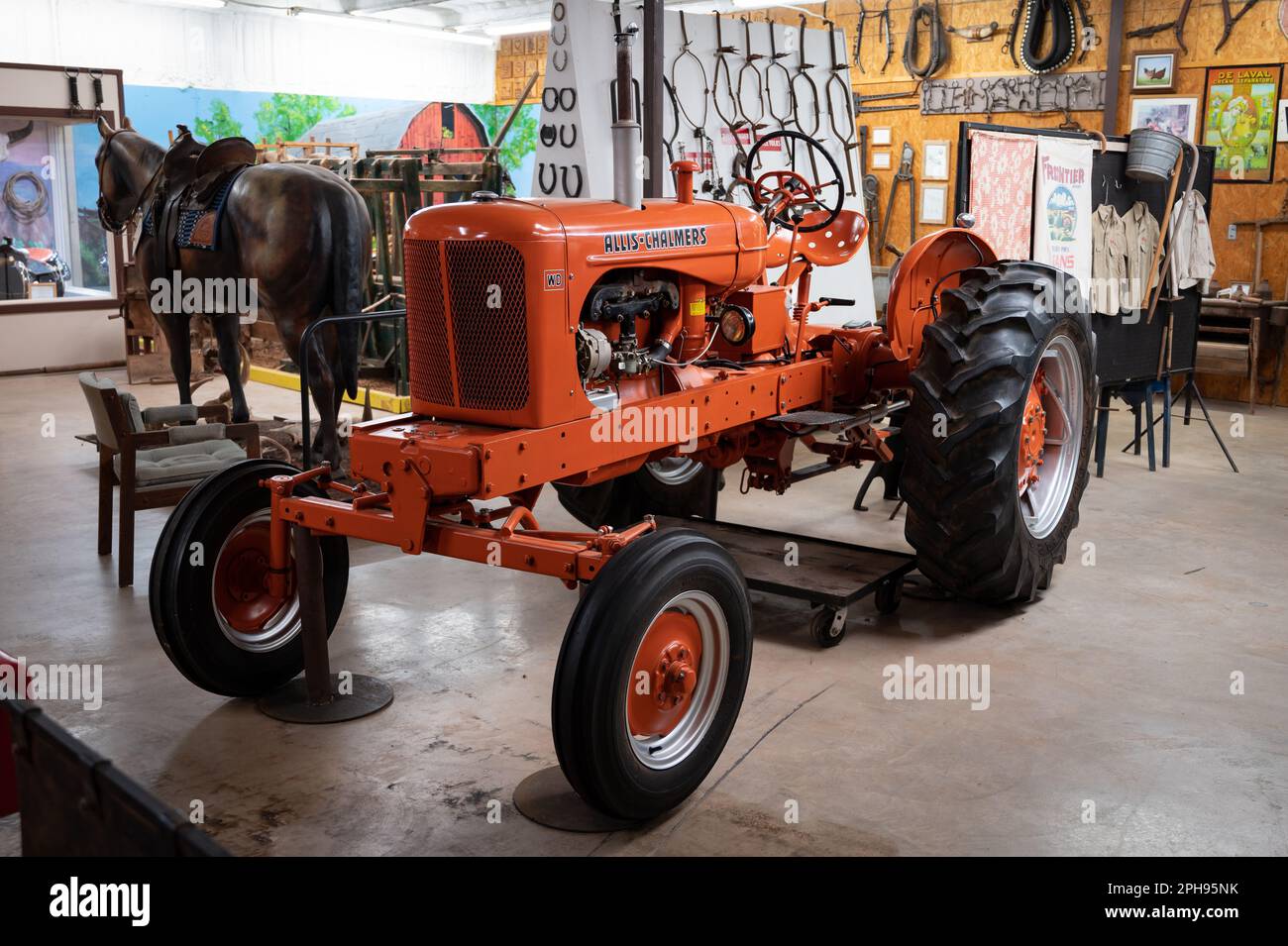 A tractor is parked inside a garage Stock Photo - Alamy