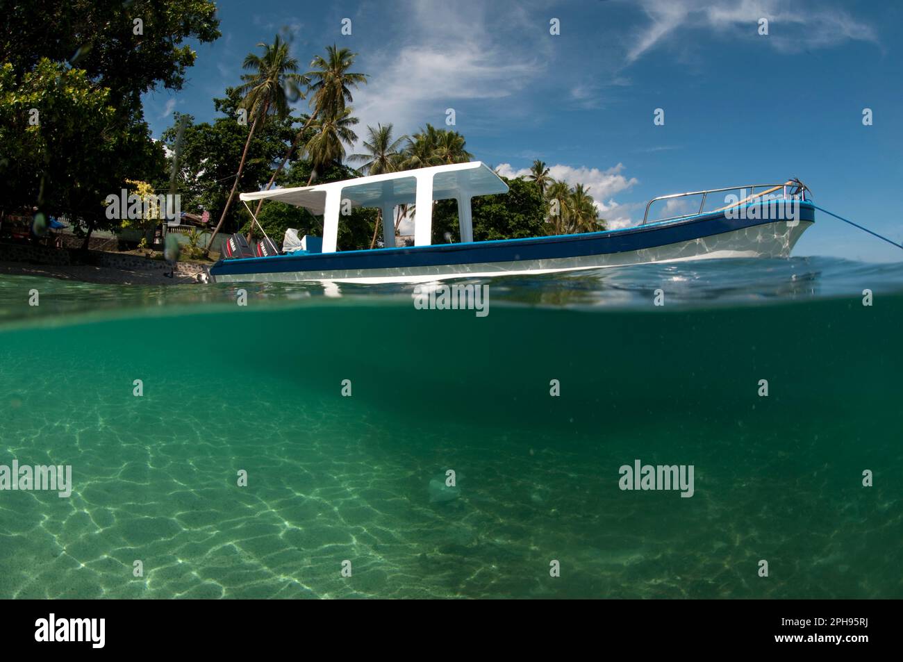 Boat by beach, Ambon, Indonesia Stock Photo - Alamy