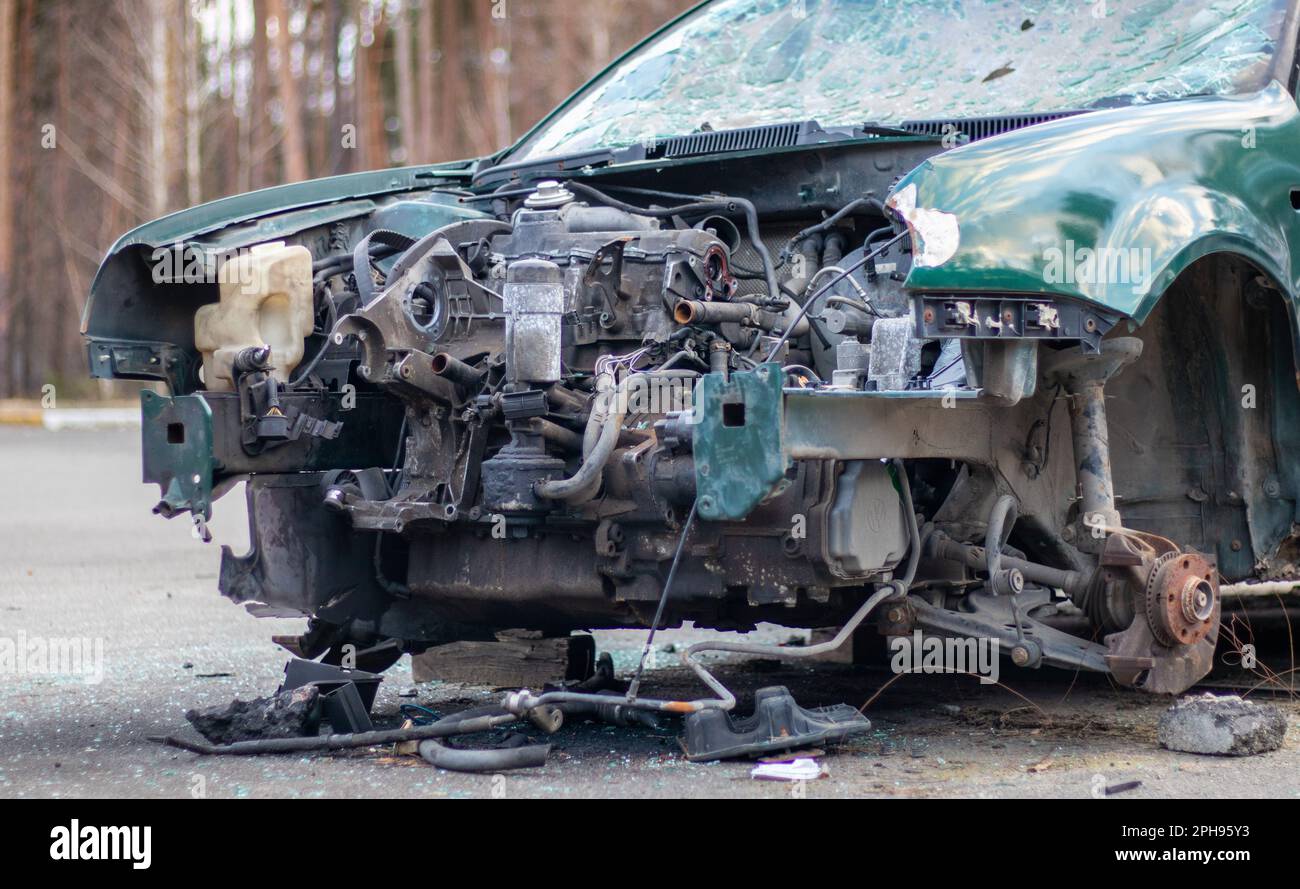 Broken crumpled car after a severe accident with a skewed body, after a ...