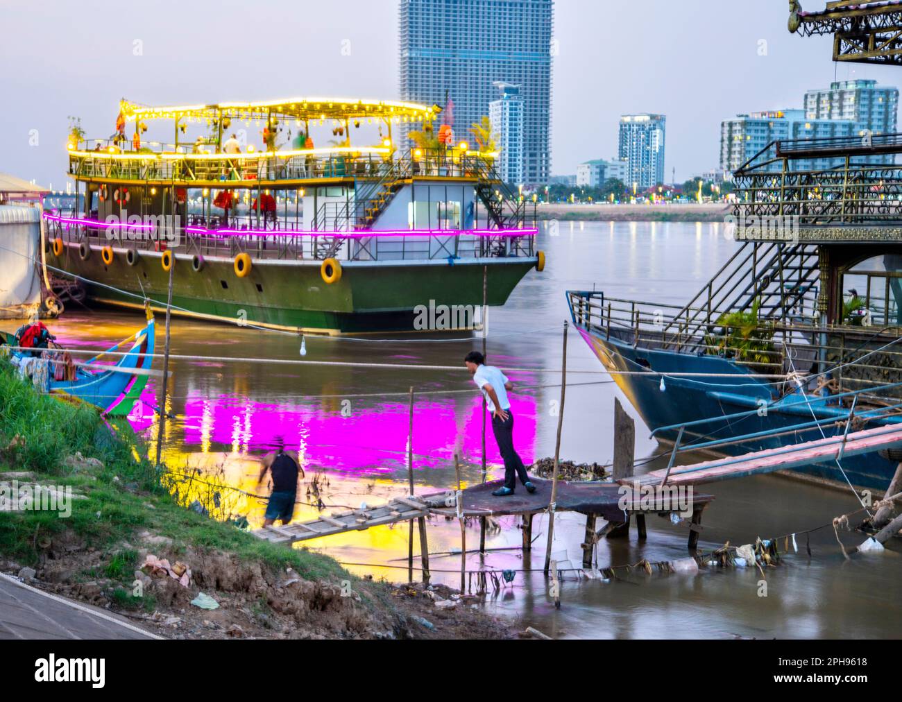 Colorfully lit at dusk,on the Riverside area of Phnom Penh,used as a ...