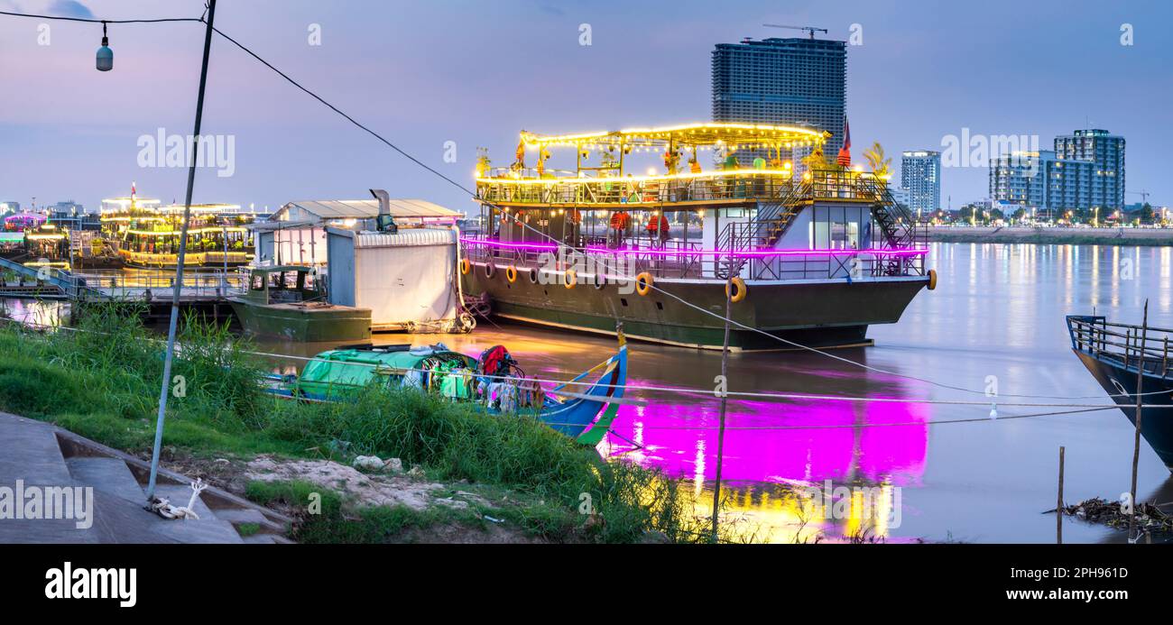 Colorfully lit at dusk,on the Riverside area of Phnom Penh,used as a ...
