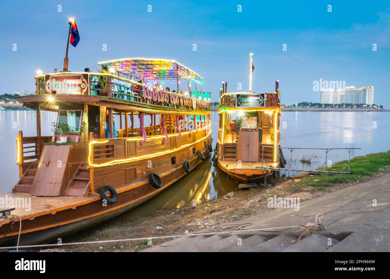Phnom Penh,Cambodia-December 23rd 2022:River cruise boats wait for more ...