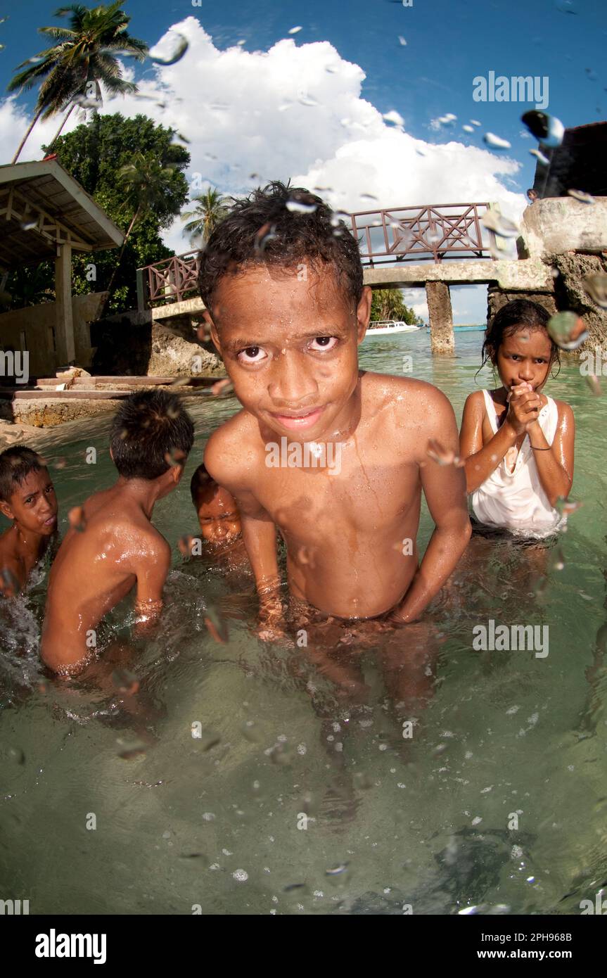 Children playing in shallow water hi-res stock photography and images ...