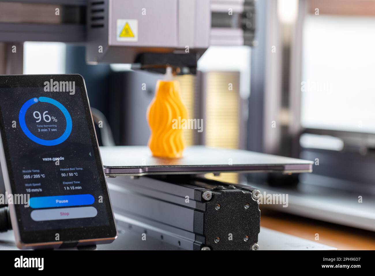 Application for control 3D printer displayed on smartphone. Against the ...