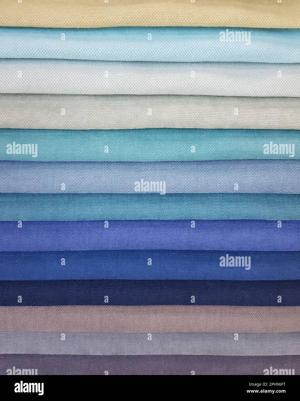 Rainbow clothes stack. Bright colourful fabric Stock Photo - Alamy