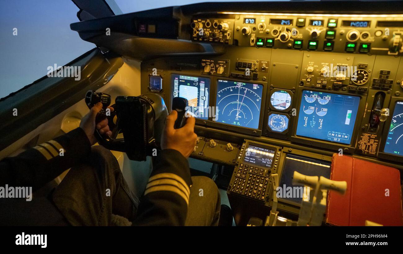 A man is studying to be a pilot in a flight simulator. Close-up of male ...