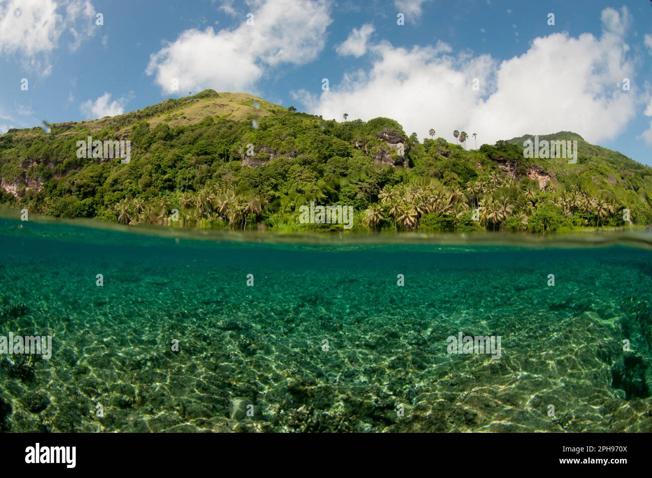 Split shot of coastline, reef and land, Tanimbar, Forgotten Islands ...