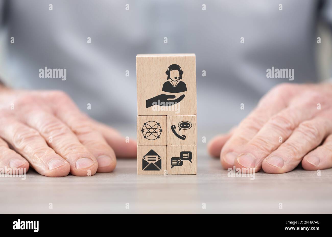 Wooden blocks with symbol of customer service concept Stock Photo - Alamy