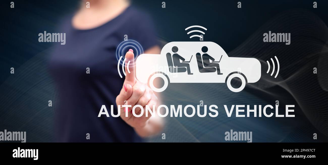 Woman touching an autonomous vehicle concept on a touch screen with her ...