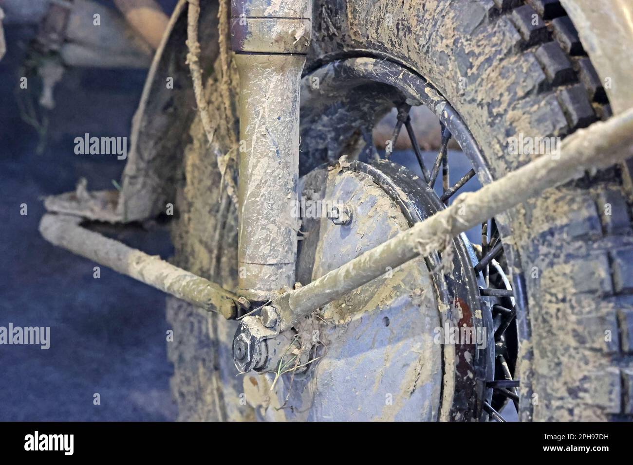 Wheel of an old motorcycle in the mud Stock Photo - Alamy