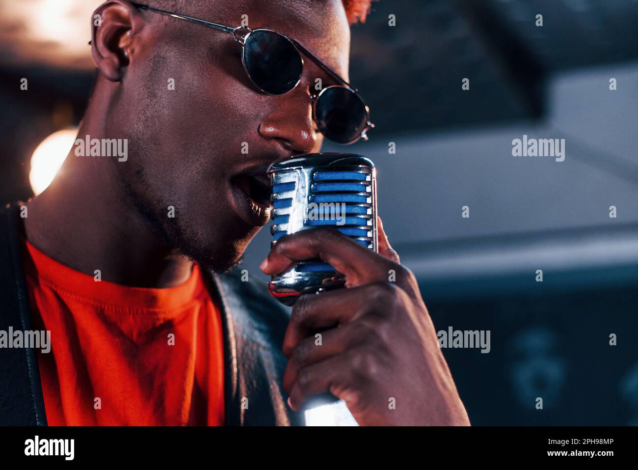 Having vocal practice. Young african american performer rehearsing in a ...