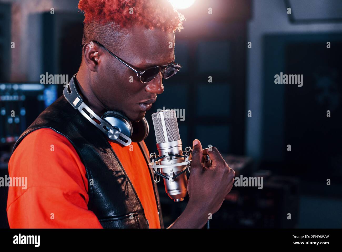 Young african american performer rehearsing in a recording studio Stock ...