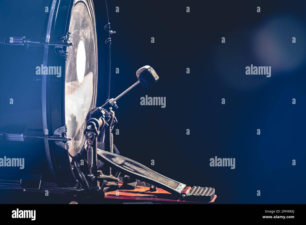 Bass drum with pedal, musical instrument on black background Stock ...