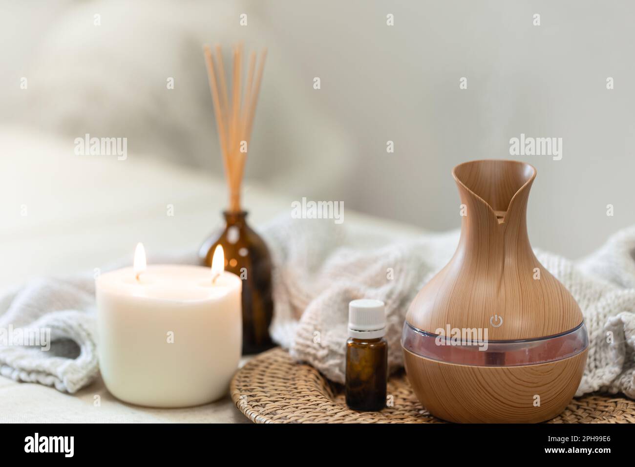 Spa composition with aroma oil diffuser lamp on a blurred background Stock Photo - Alamy
