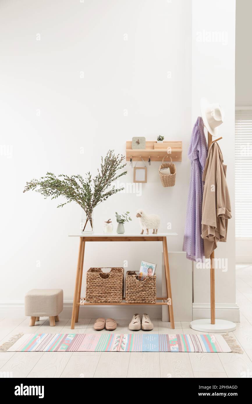 Modern hallway interior with table, clothes rack and key holder Stock ...