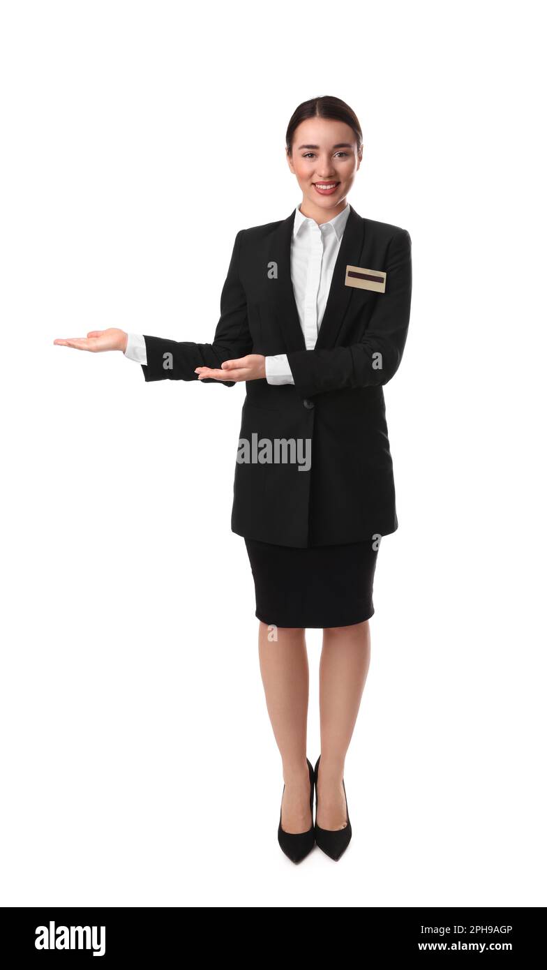Full length portrait of happy young receptionist in uniform on white ...
