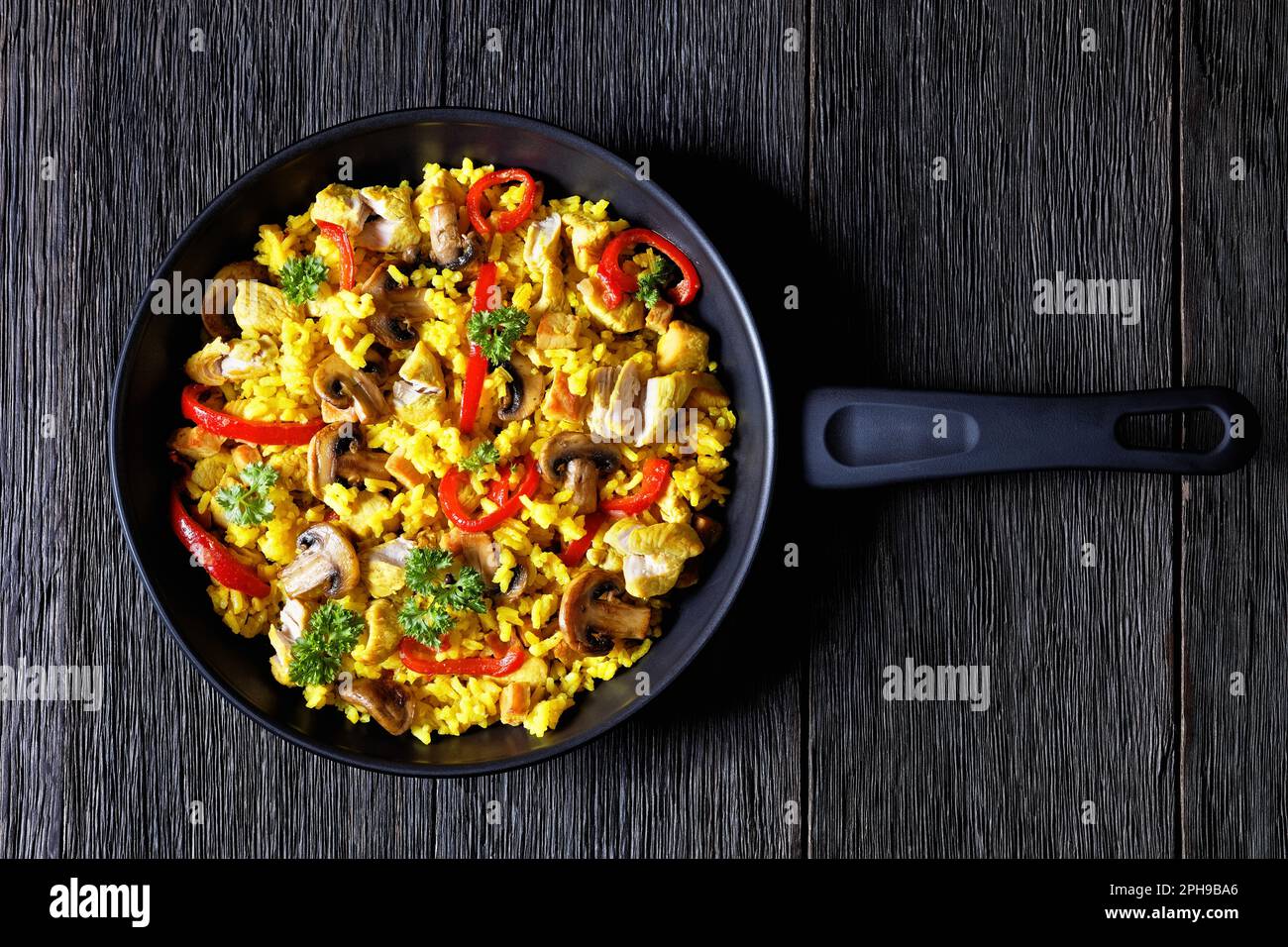 Chicken Paella of arborio rice, chicken fillet, mushrooms, julienned ...