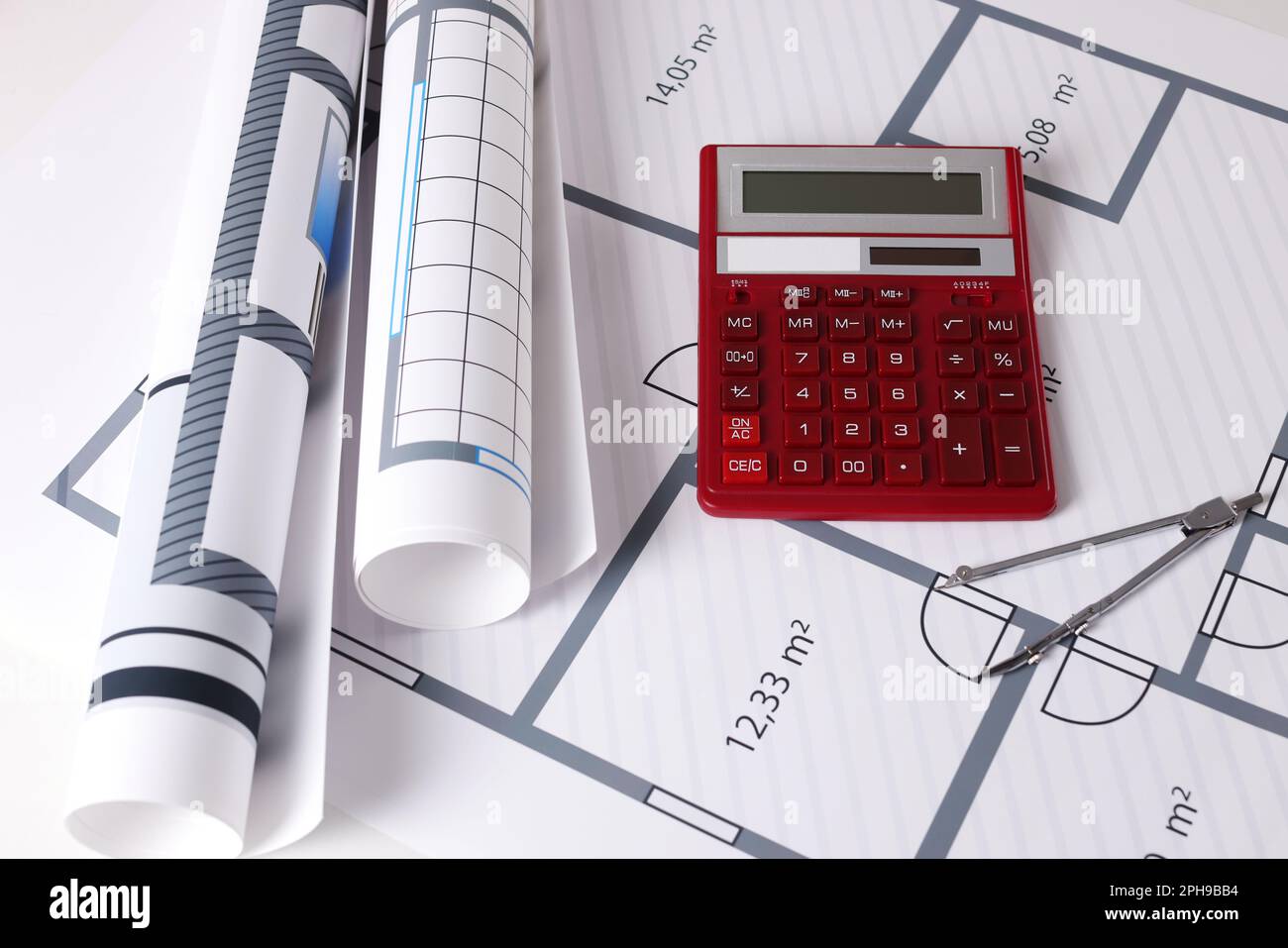 Construction drawings, calculator and dividers, closeup view Stock ...
