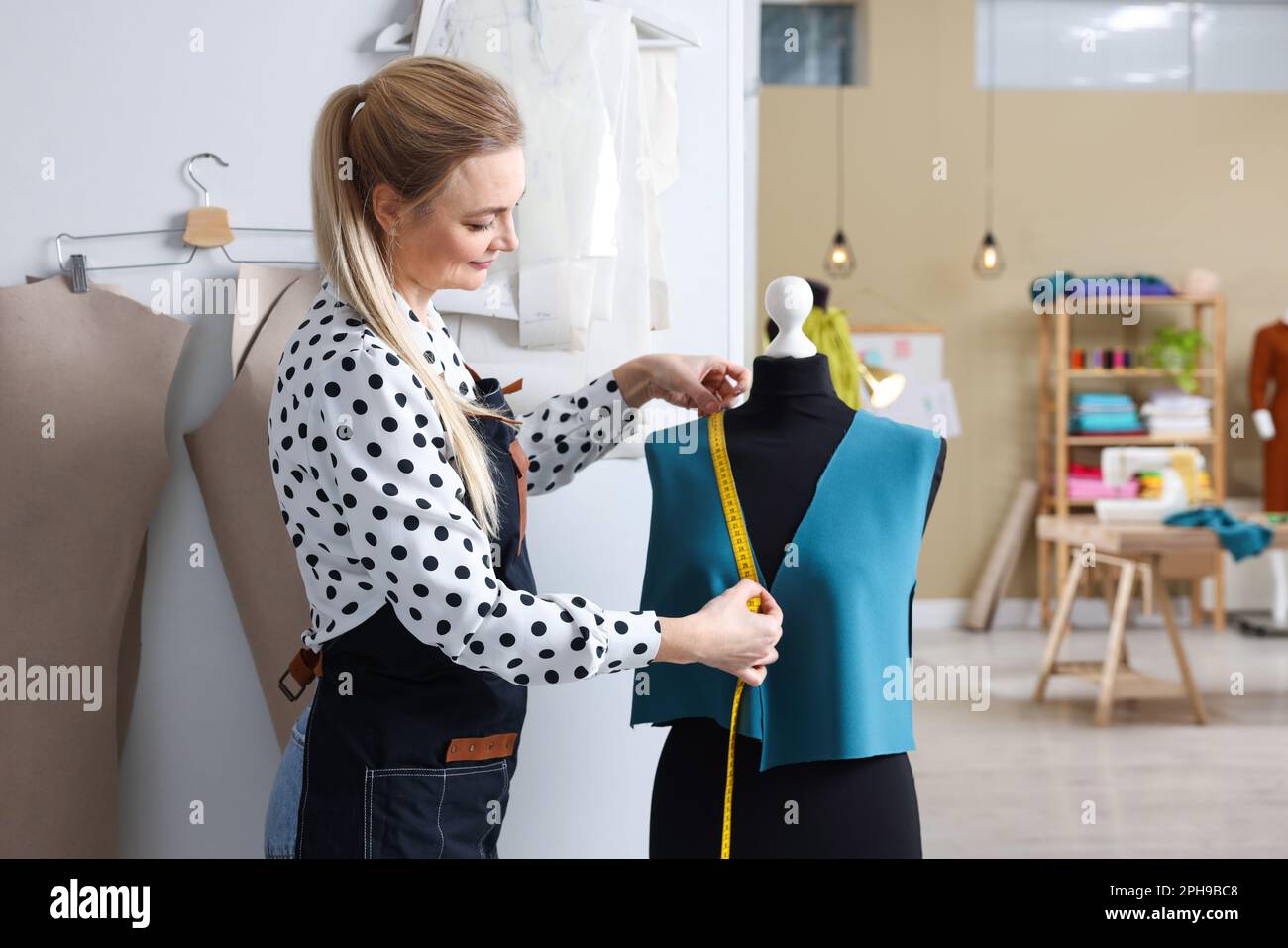 Dressmaker working measuring tape hi-res stock photography and images ...