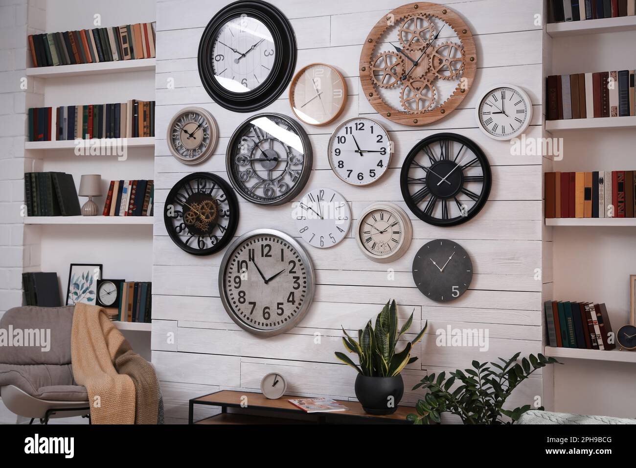 Stylish room interior with rocking chair, beautiful houseplants and ...